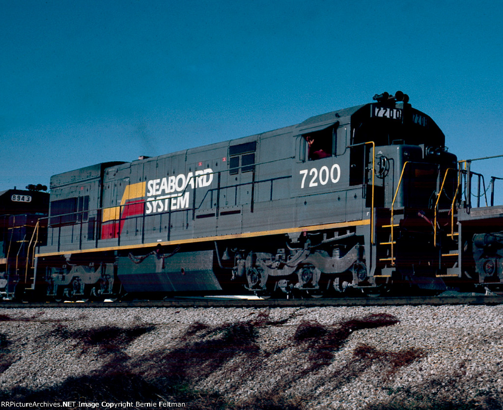 Seaboard System U30C #7200, serving as a caboose for the waving conductor,